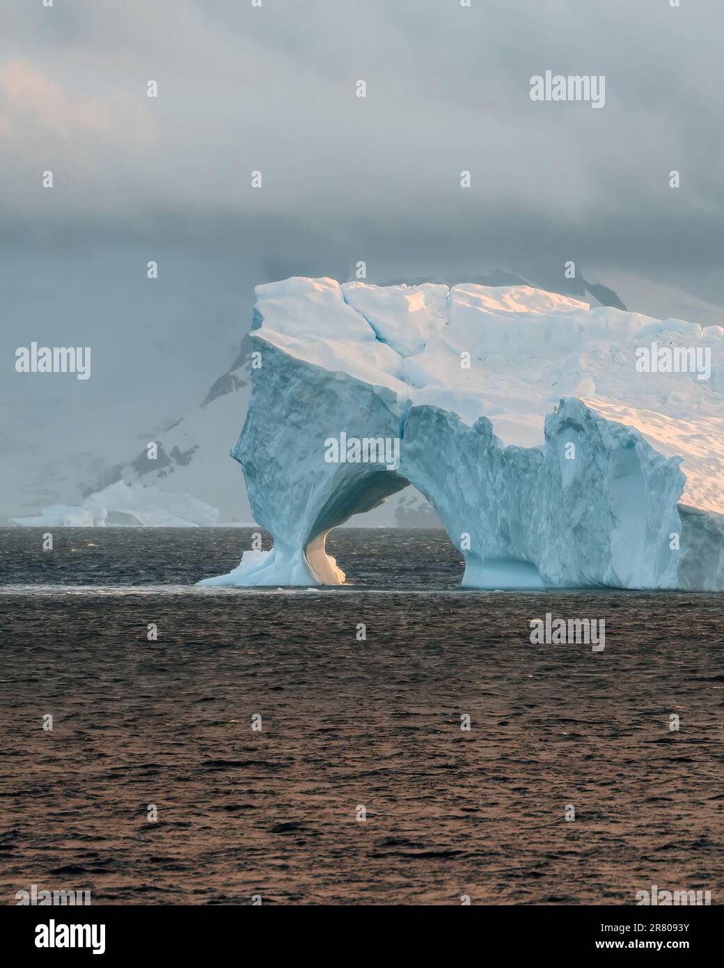 Beautiful iceberg floating in the water. Photo taken at sunset in ...