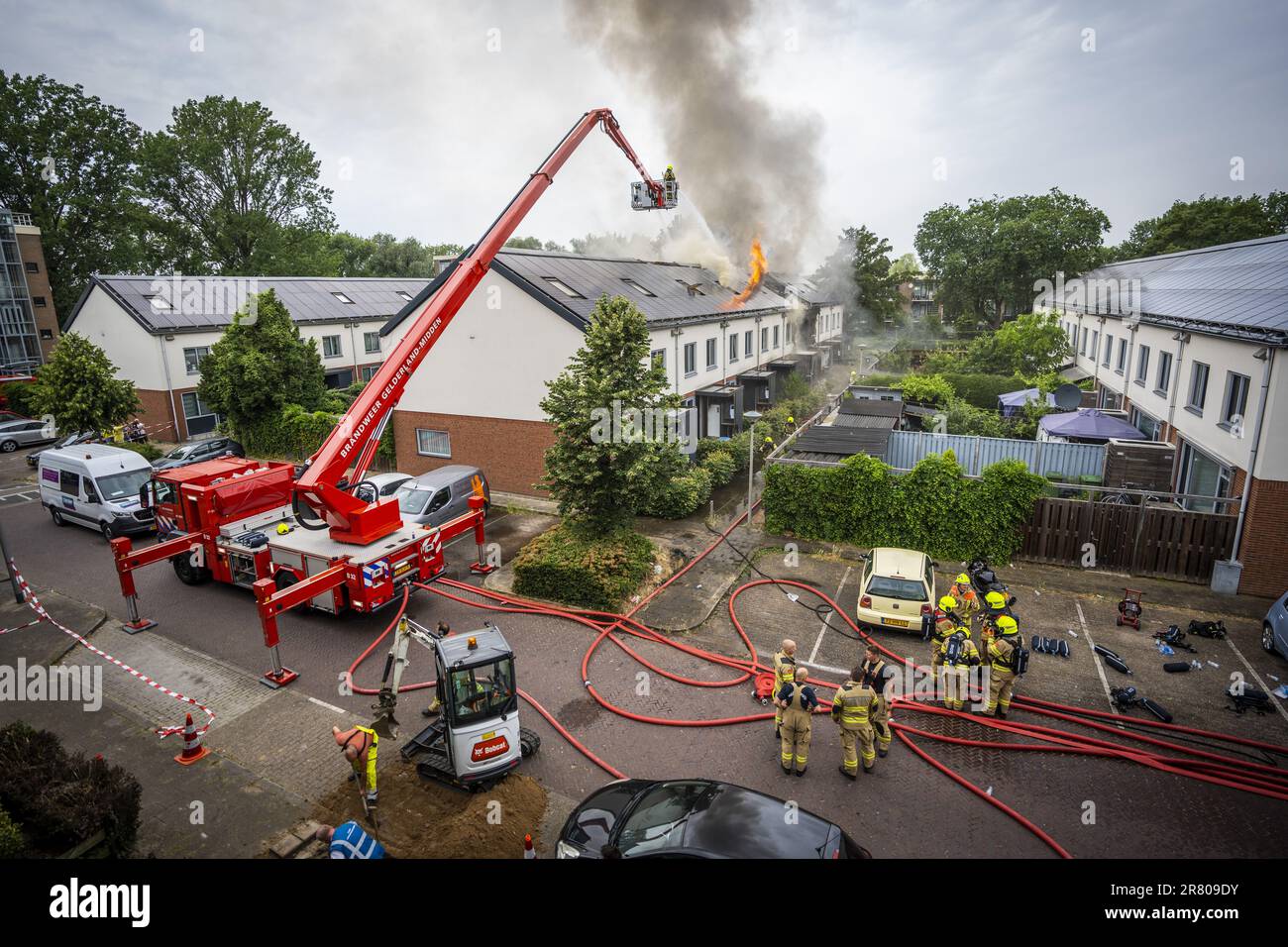ARNHEM - The fire brigade extinguishes a fire in a block of houses in ...