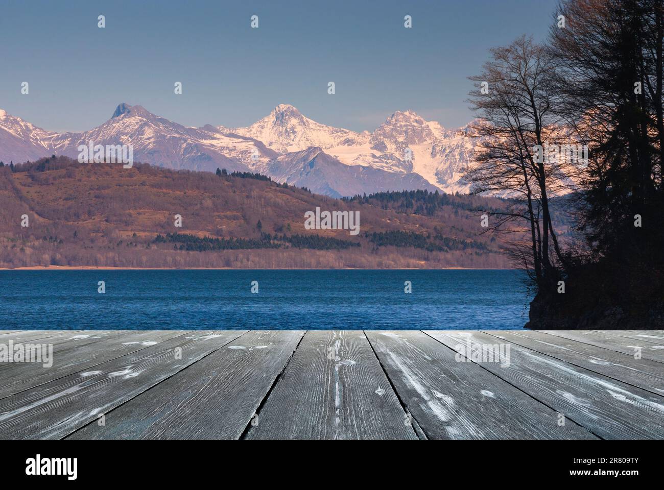 beautiful lake with empty wooden table. Natural template landscape ...
