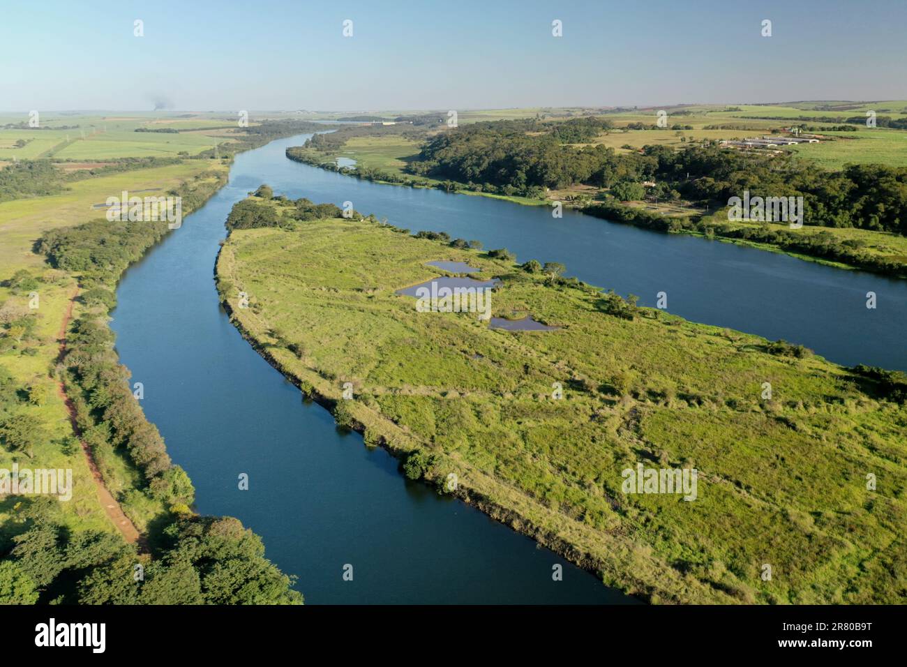 Tiete River opening into two channels - drone view Stock Photo - Alamy