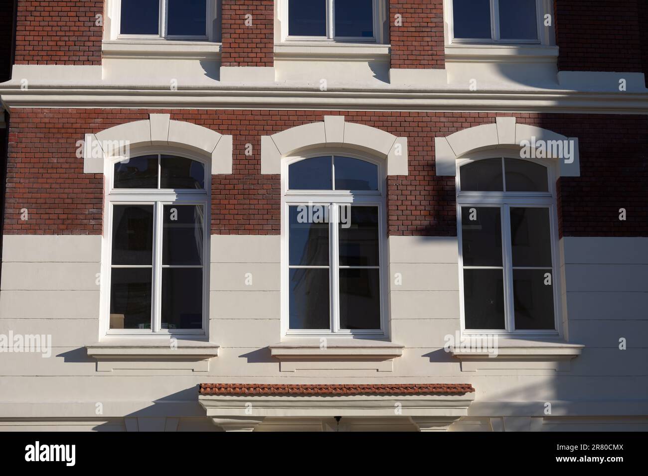 Front view of the curtain wall of the historic building with large ...