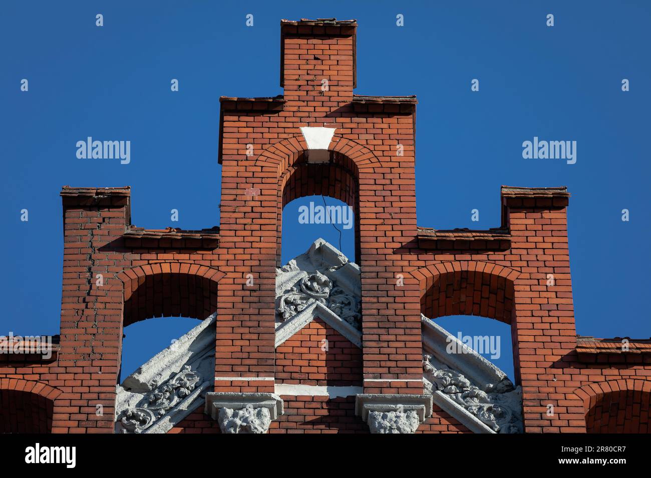 Topping the gable wall of a historic red brick building Stock Photo - Alamy