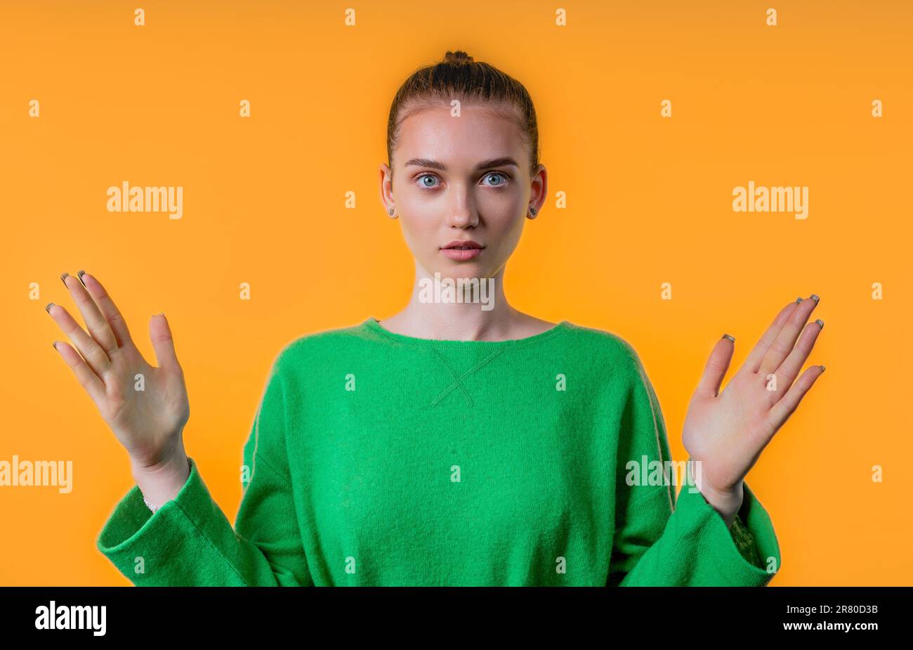 Young woman showing big invisible abstract subject, object sizes. Large ...