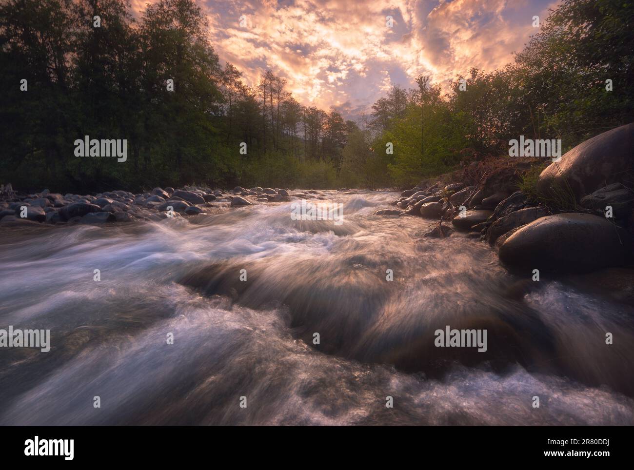 beautiful sunrise over fast flowing mountain river Stock Photo - Alamy