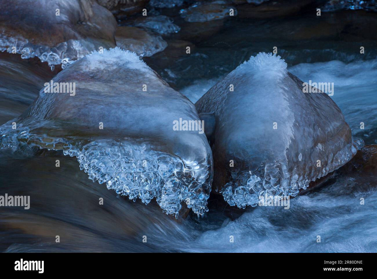 Cold water. remnants of ice with stones. winter nature Stock Photo - Alamy
