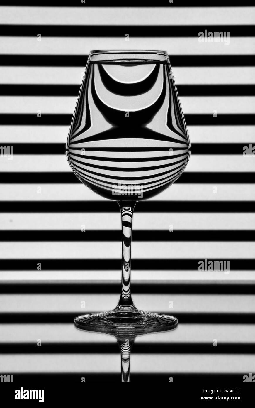 Pattern distortions seen through a glass of water. Still life Stock ...
