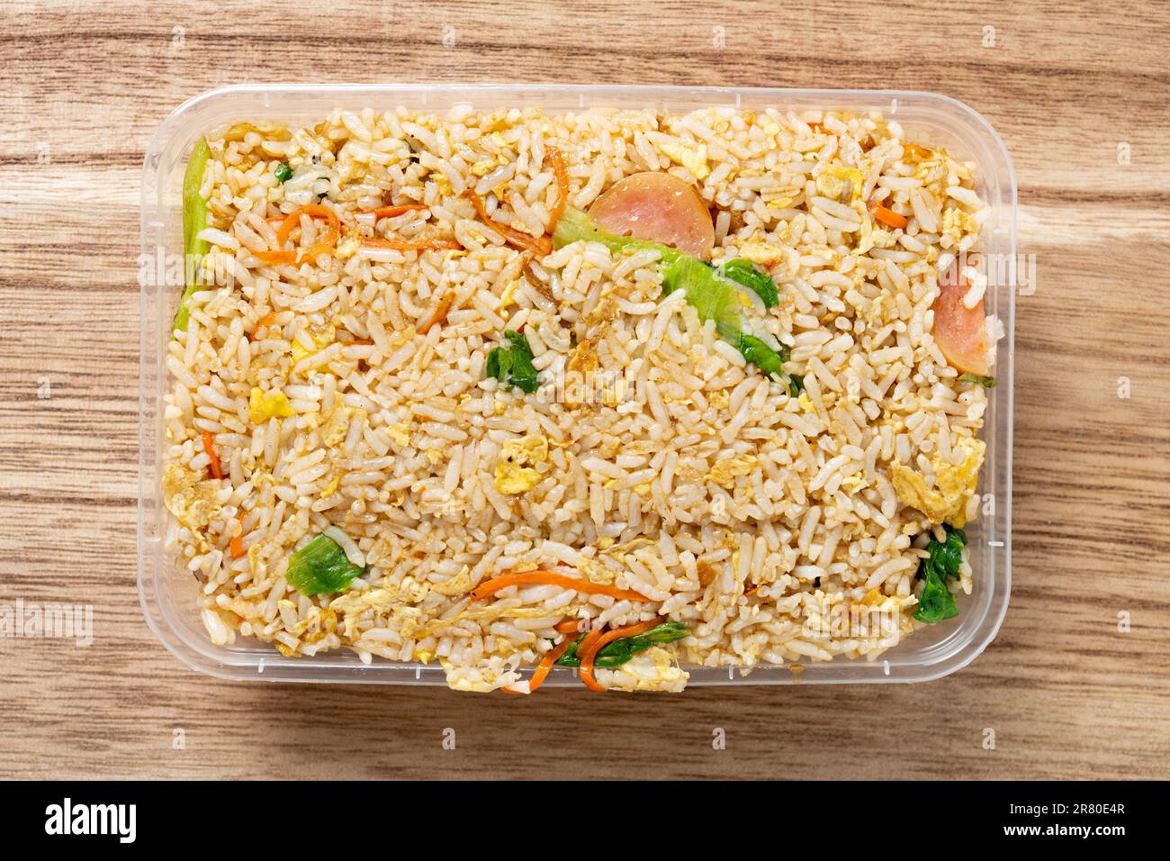 top view takeaway box of fried rice with yolk Stock Photo - Alamy