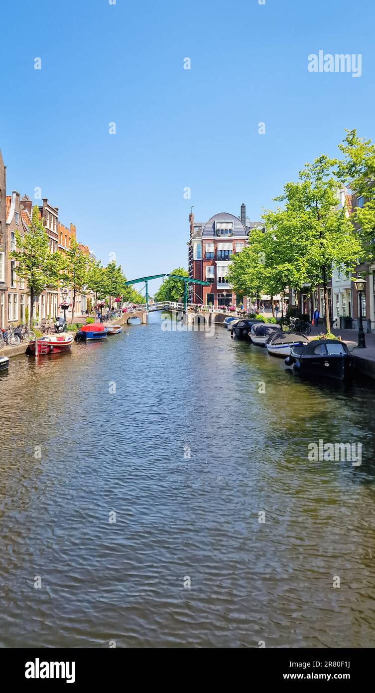 One of the famous Dutch city canals in the historic city of Leiden ...