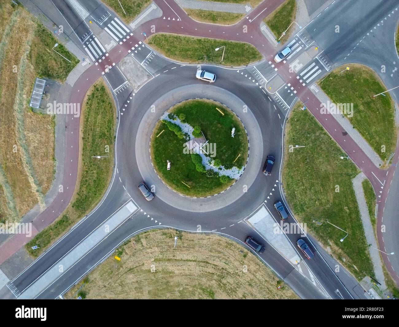Aerial view of cars on a roundabout or traffic circle Stock Photo - Alamy