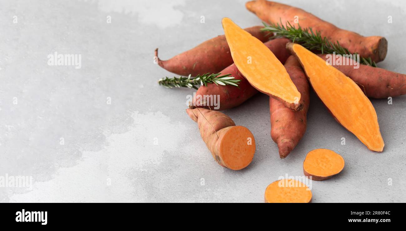 Raw sweet potatoes whole and cut. Orange kumara, sweet potato ...