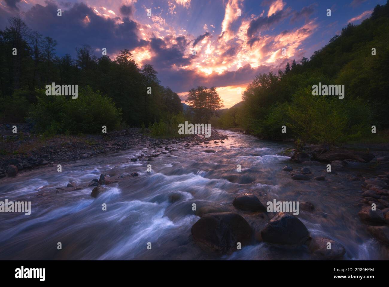 beautiful sunrise over fast flowing mountain river Stock Photo - Alamy