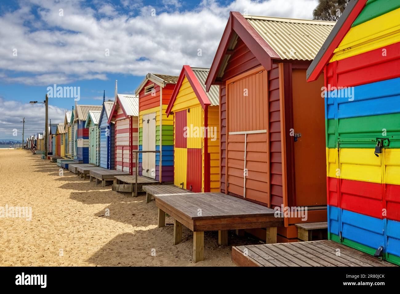Brighton beach Victorain bathing boxes. Brightly painted colourful ...