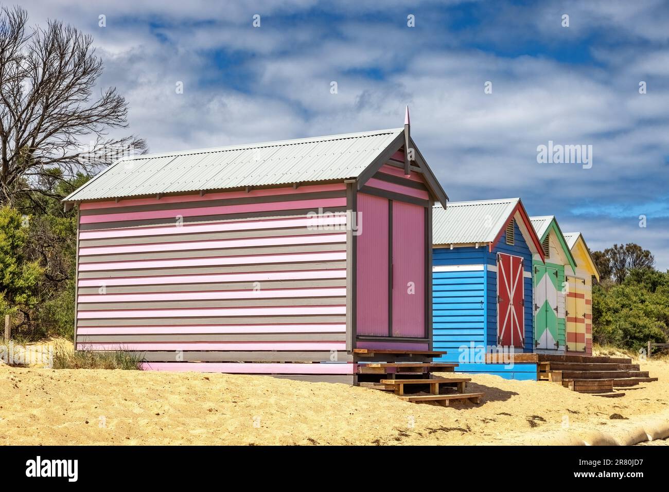 Brighton beach Victorain bathing boxes. Brightly painted colourful ...