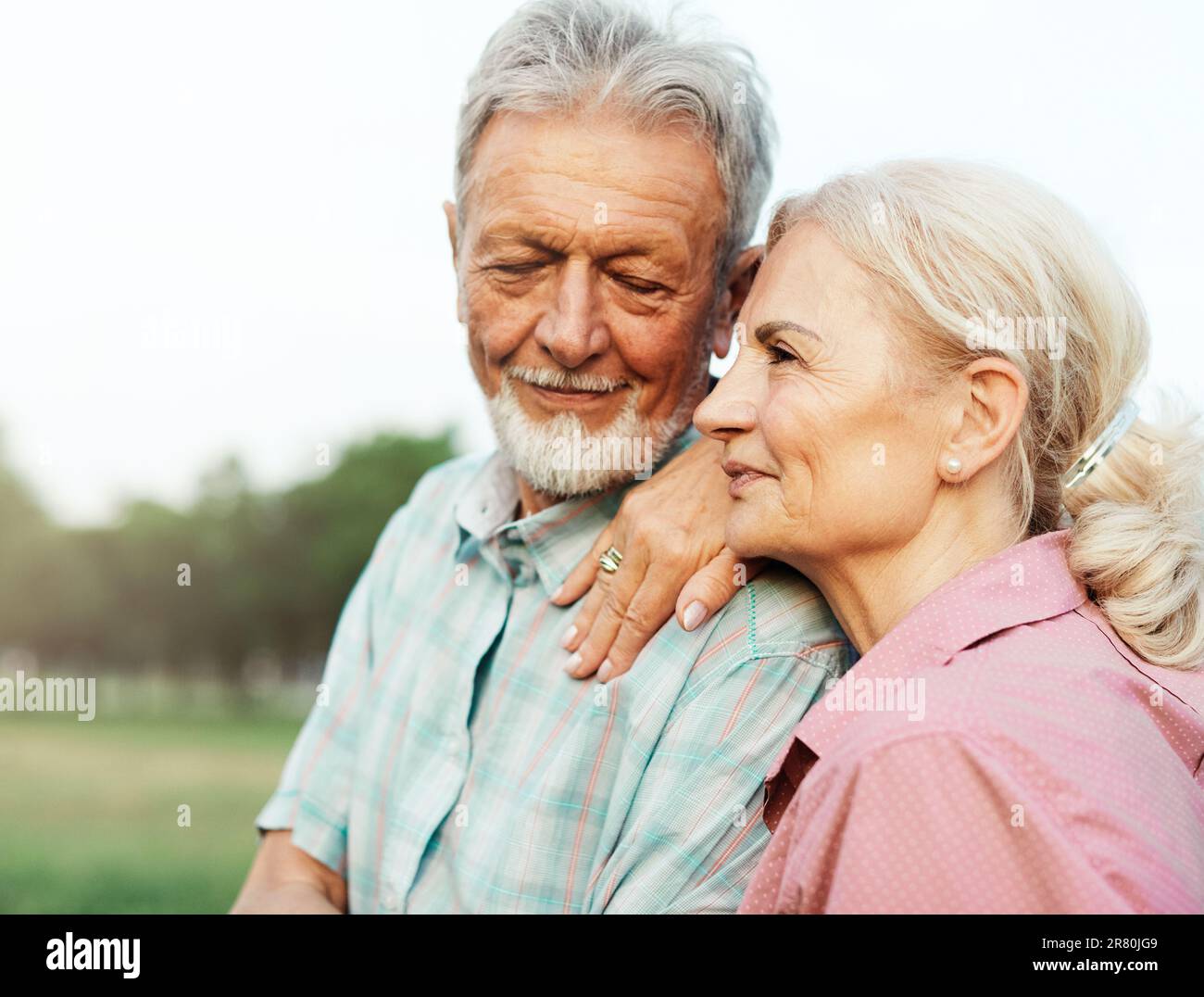 Happy active senior couple having fun outdoors. Portrait of an elderly ...