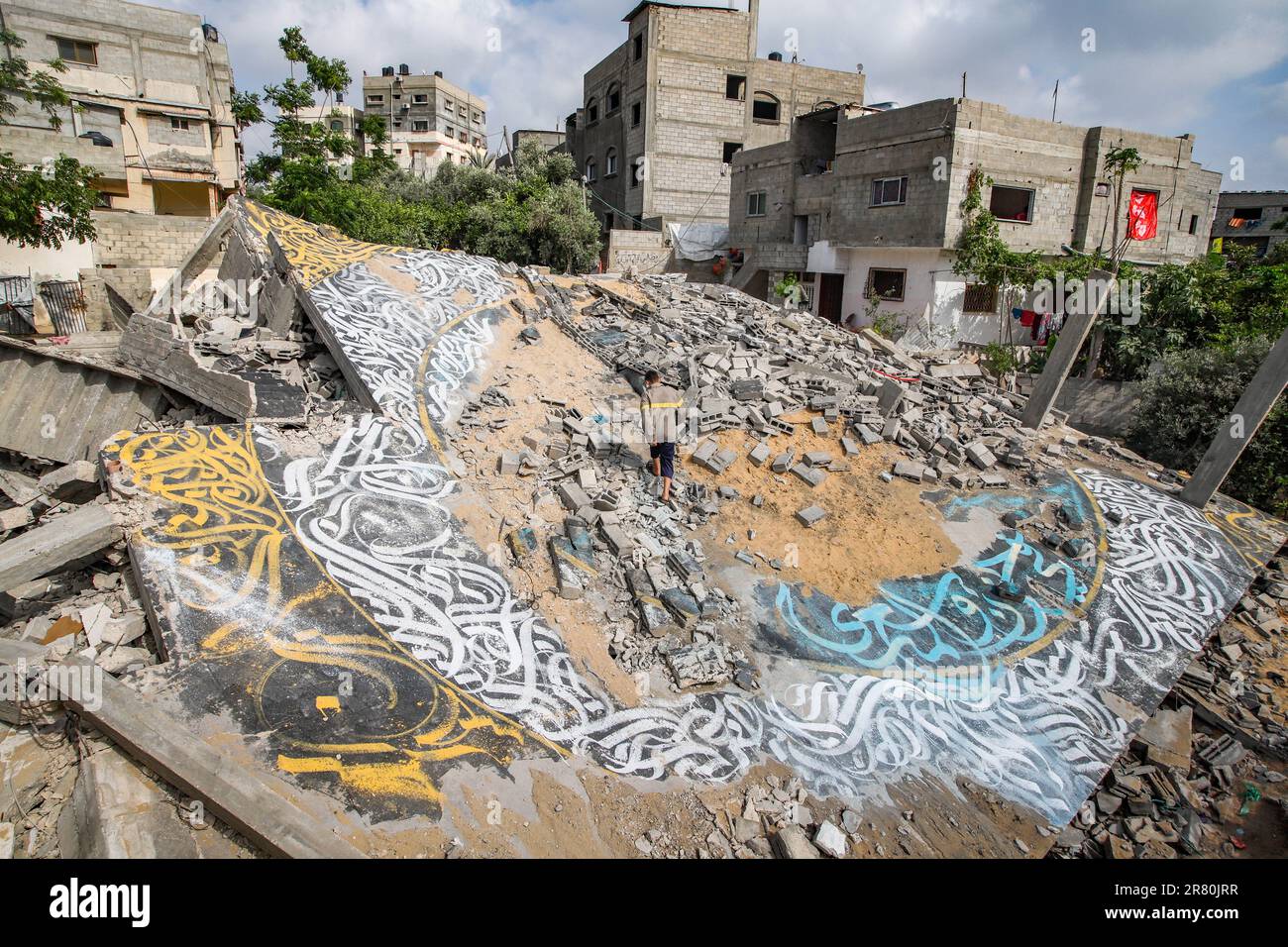 Gaza, Palestine. 18th June, 2023. A Palestinian sitting near of mural ...