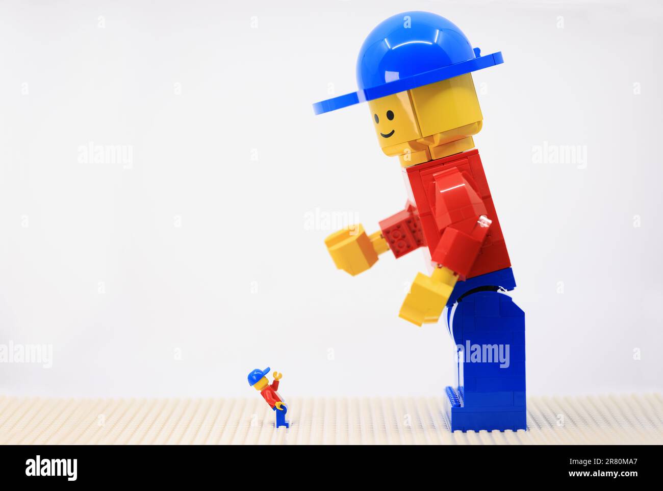 giant man face the small size man which as same as himself Stock Photo ...