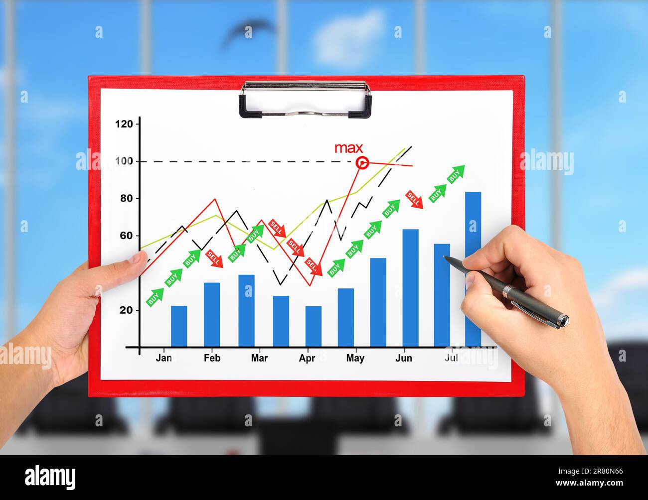 hands drawing stock chart in red clipboard Stock Photo - Alamy