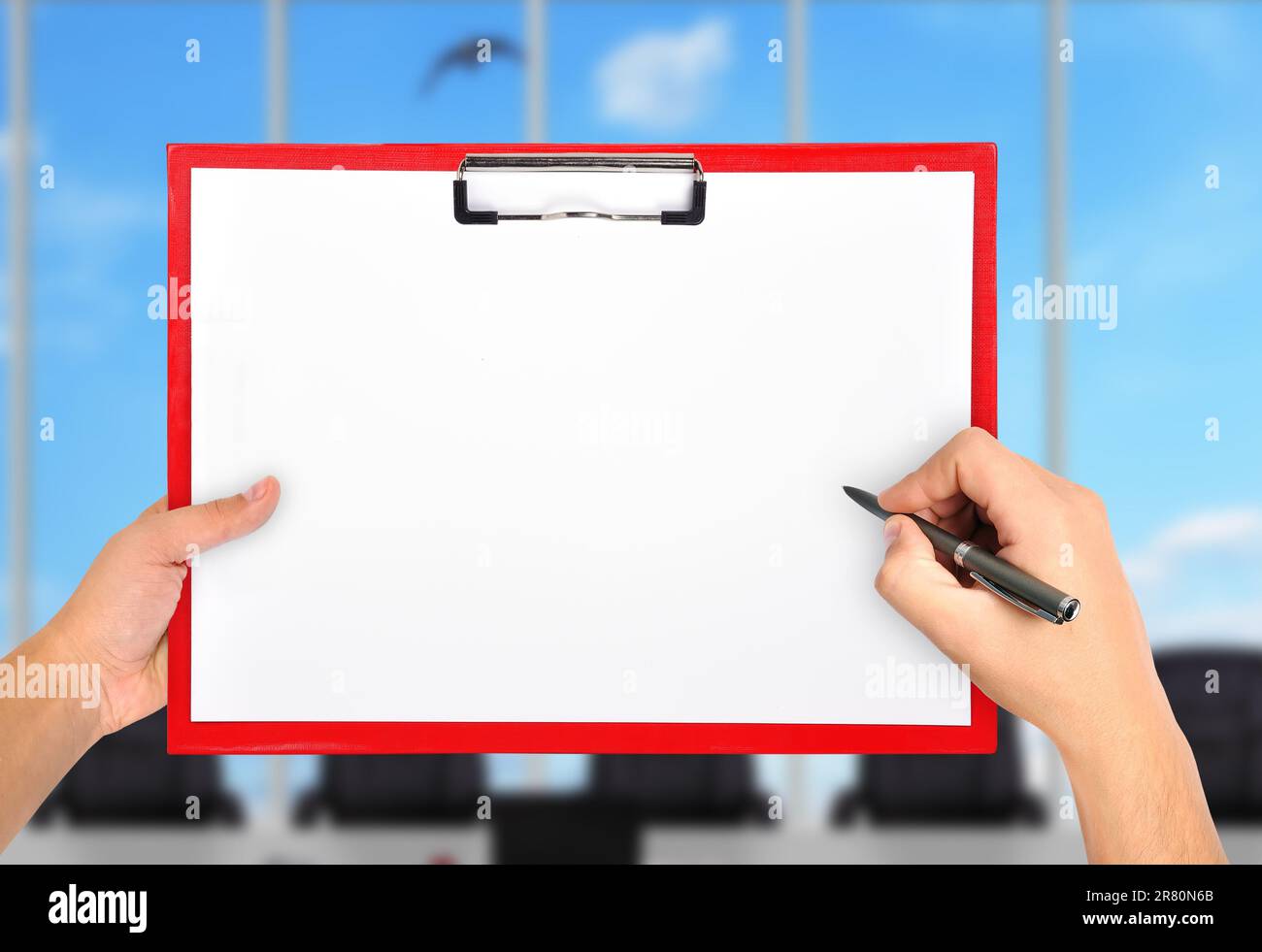 hands drawing in blank red clipboard Stock Photo - Alamy