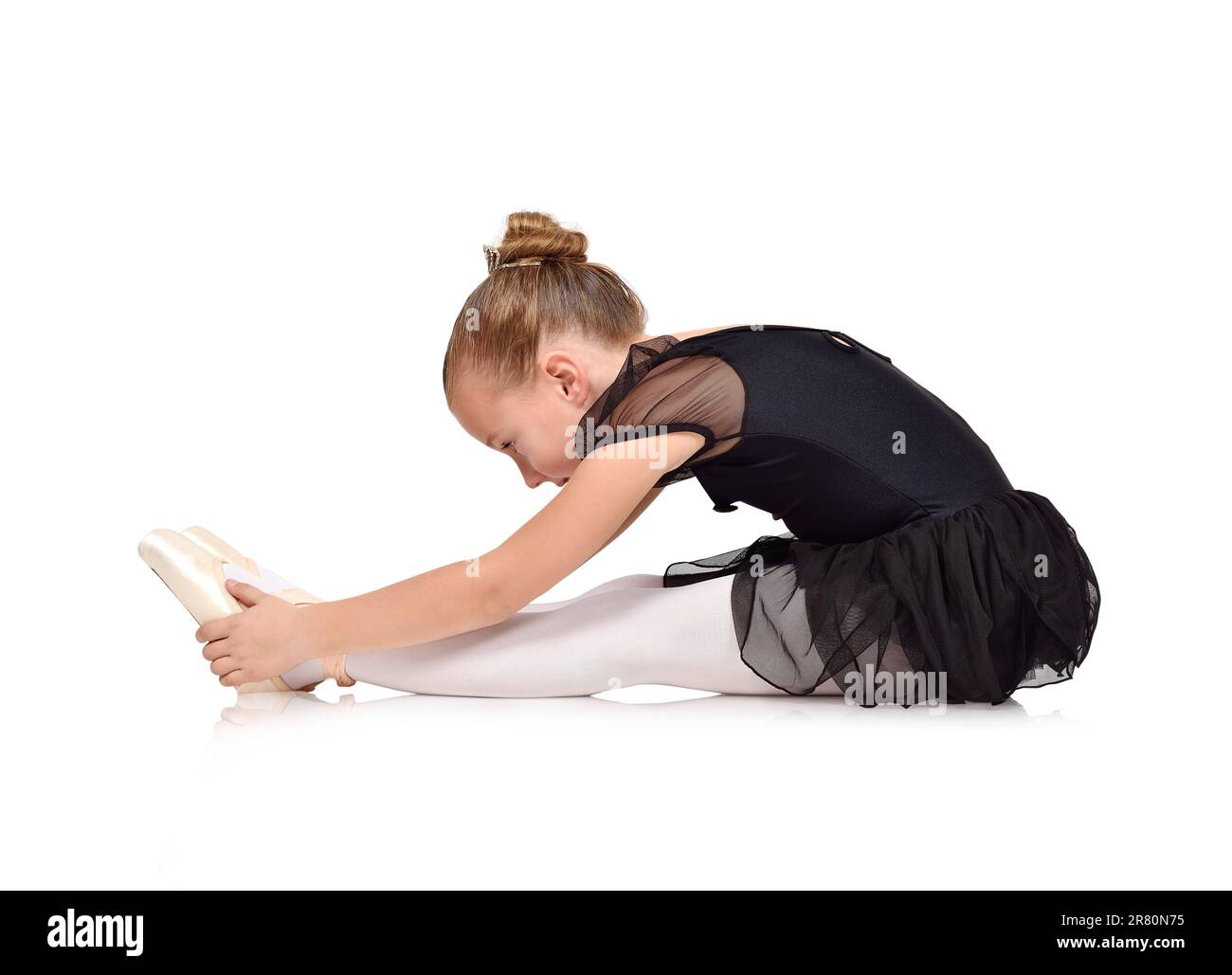 tired ballet dancer lying on the floor on white background Stock Photo ...