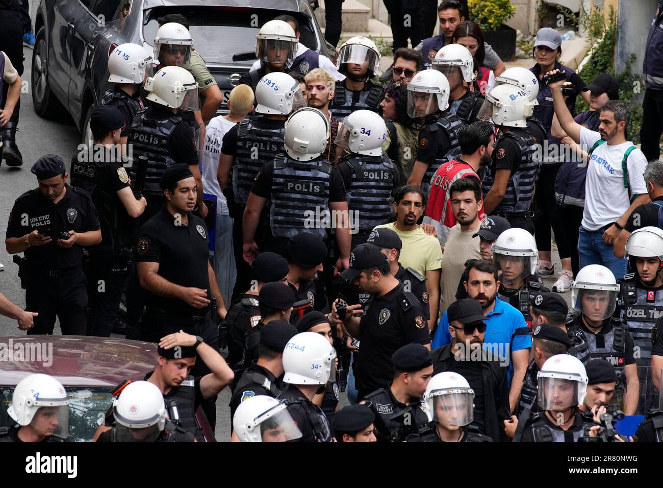 People are detained by police during a march in support of transgender ...