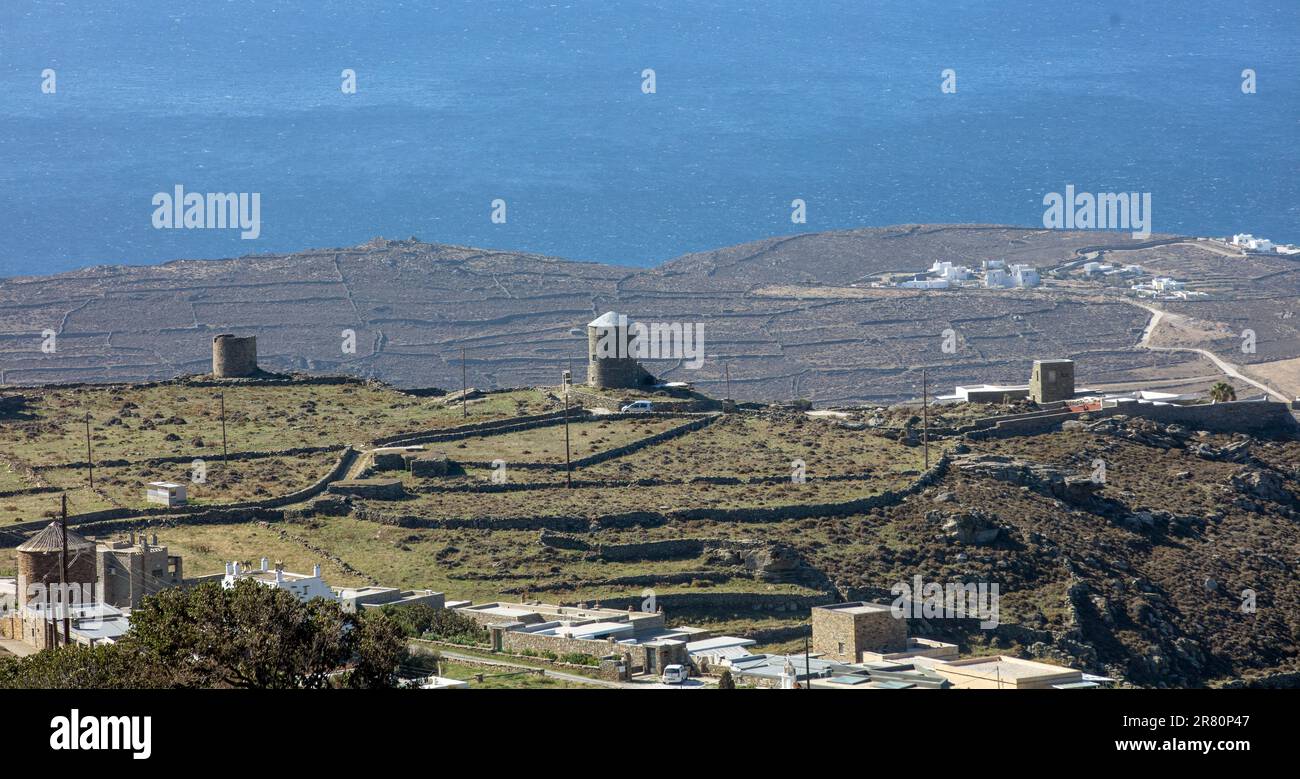 Old traditional stonewall windmill in rural landscape, Tinos island ...