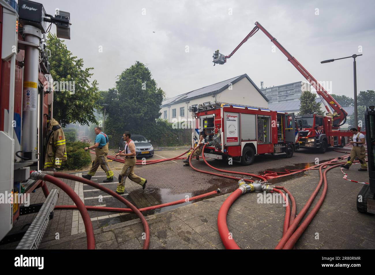 ARNHEM - The fire brigade extinguishes a fire in a block of houses in ...