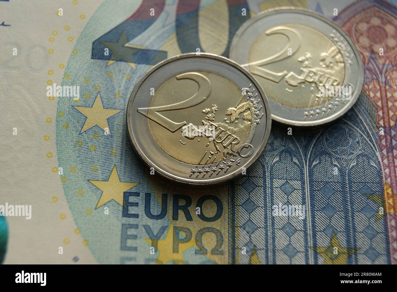 2 Euro coins on a banknote. European money close up Stock Photo - Alamy