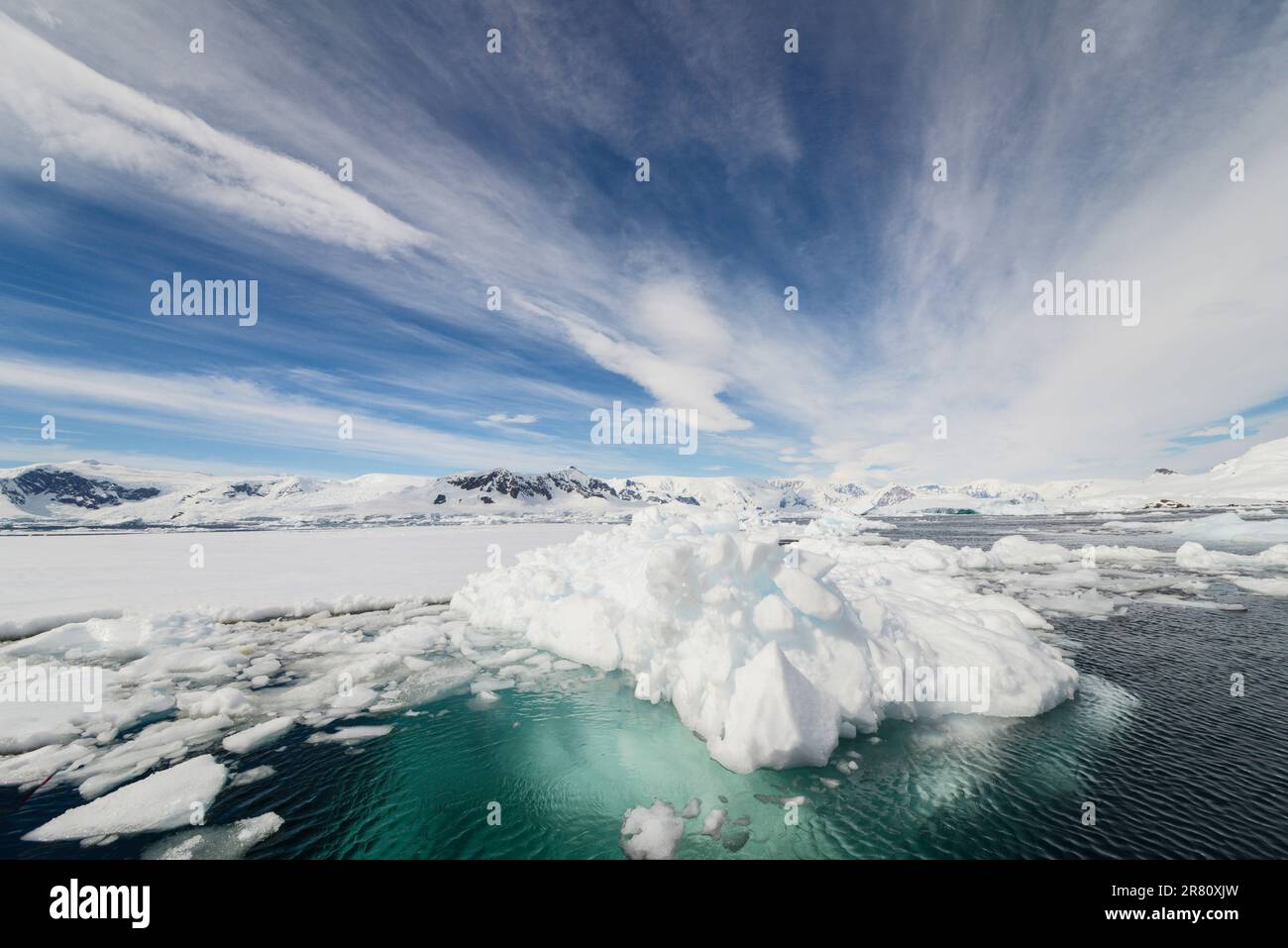 Antarctica landscape, with icebergs and crystal clear blue and ...