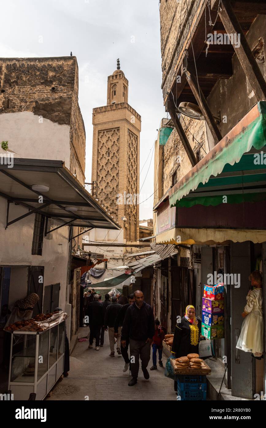 Scenic minaret of a small mosque in between residential houses in the ...