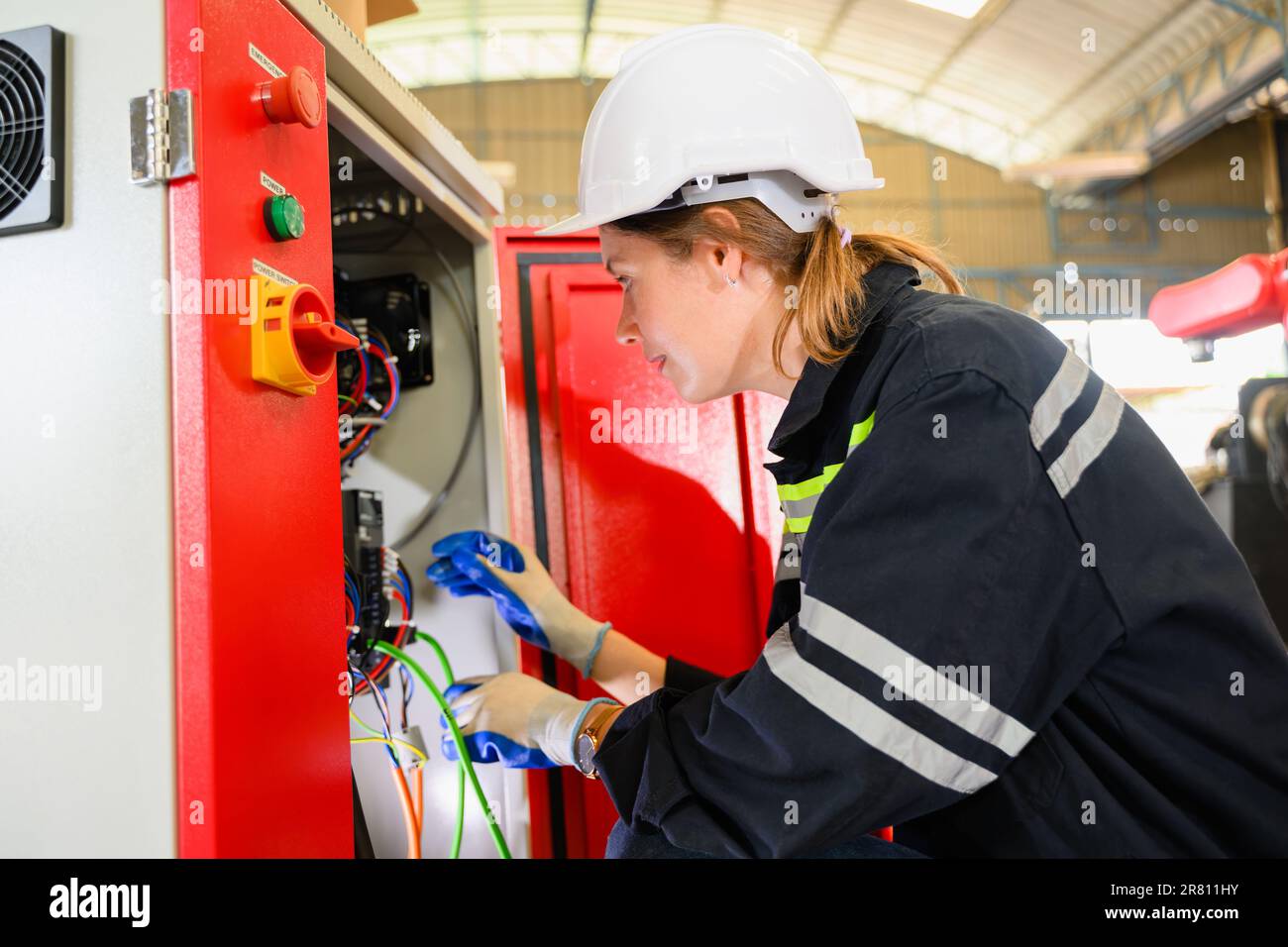 Mechanical engineer repairing engine machine at factory Stock Photo - Alamy