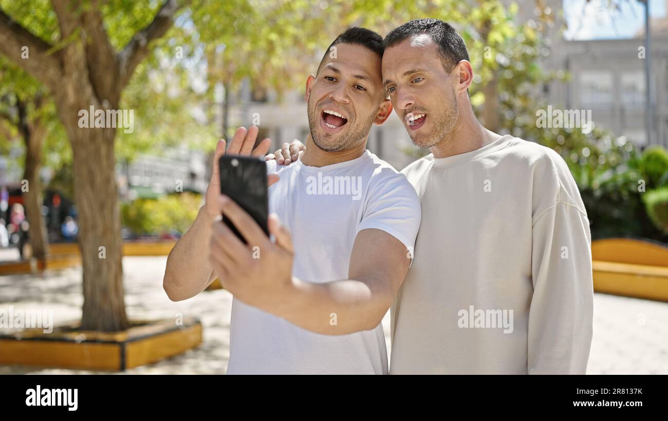 Two men couple smiling confident having video call at park Stock Photo ...