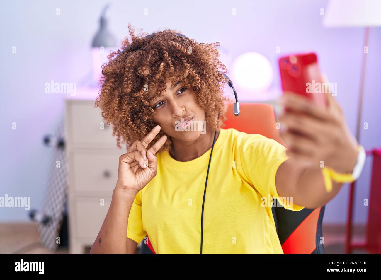 African american woman streamer make selfie by smartphone at gaming ...
