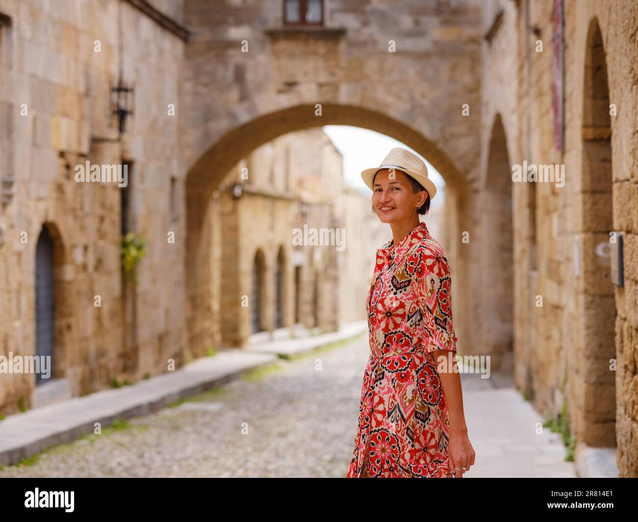 summer trip to Rhodes island, Greece. Young Asian woman in ethnic red ...