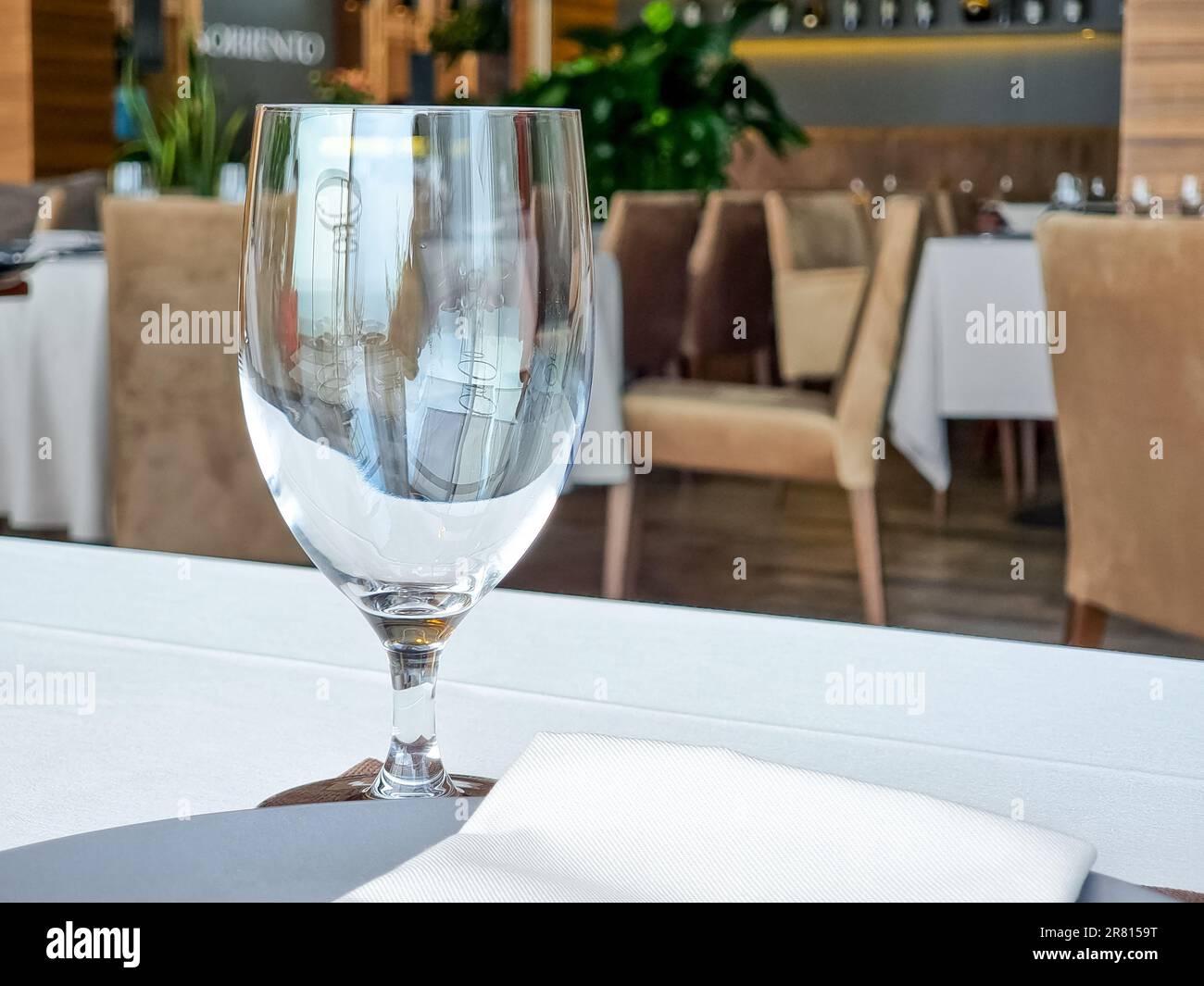 Empty glasses set in restaurant. Part of interior Stock Photo - Alamy