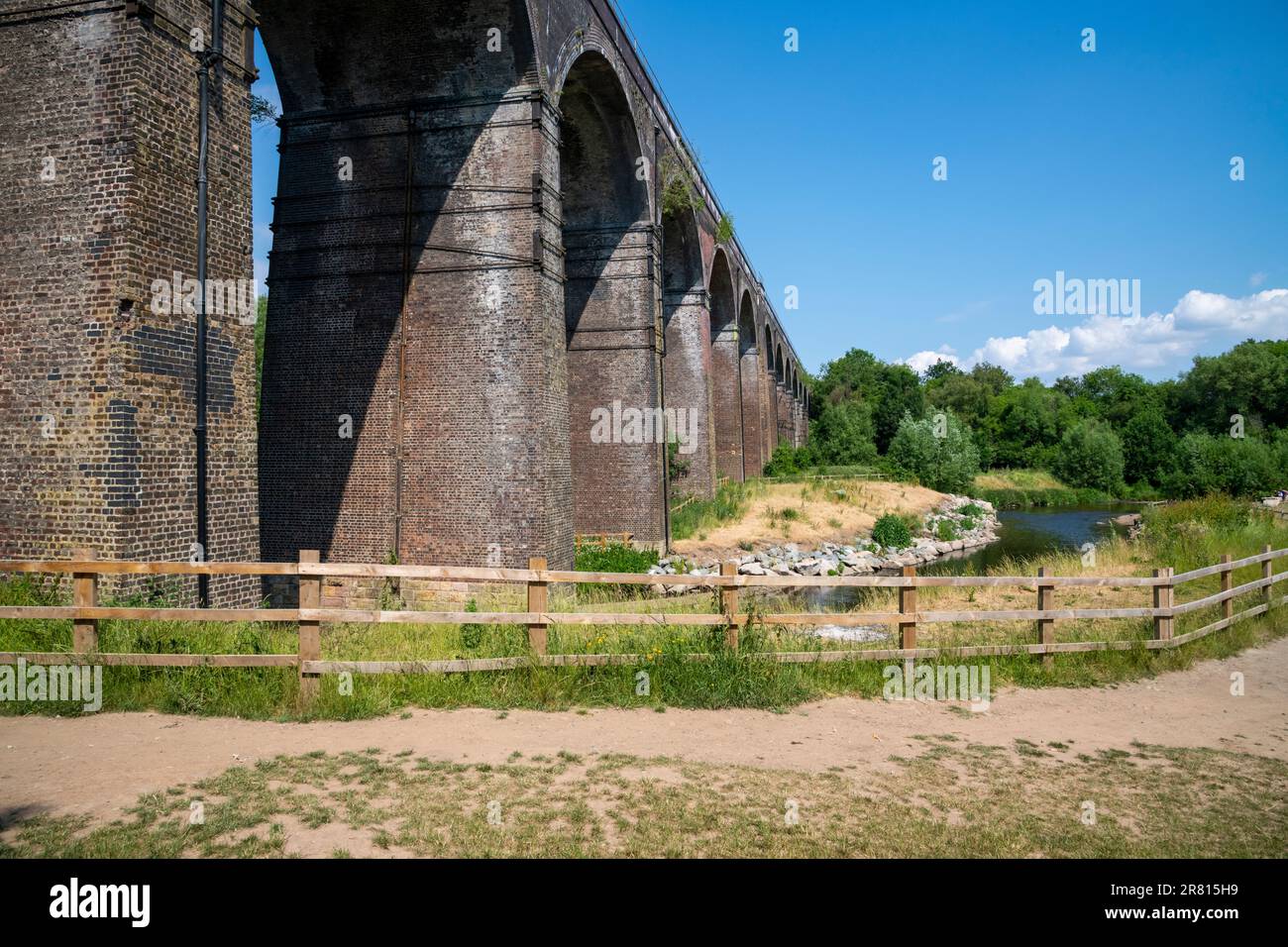Railway viaduct over the river Tame at Reddish Vale country park ...