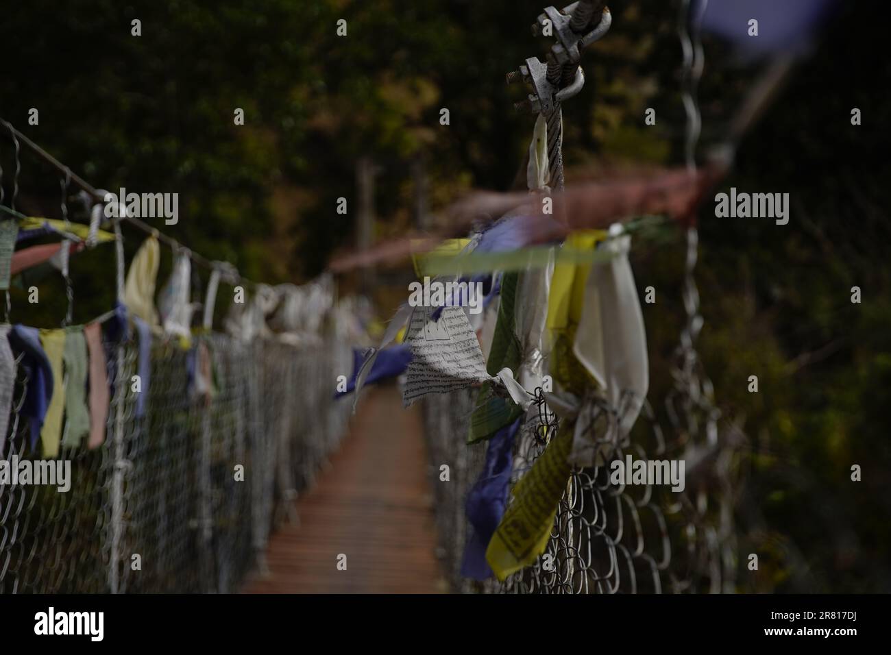 A vibrant image of a metal bridge with fabric tied to the metal fence ...