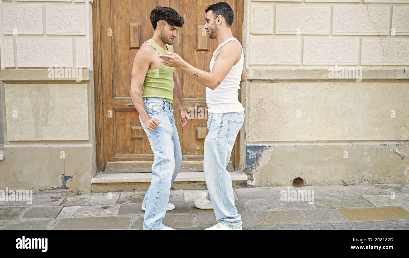 Two men couple smiling confident dancing at street Stock Photo - Alamy