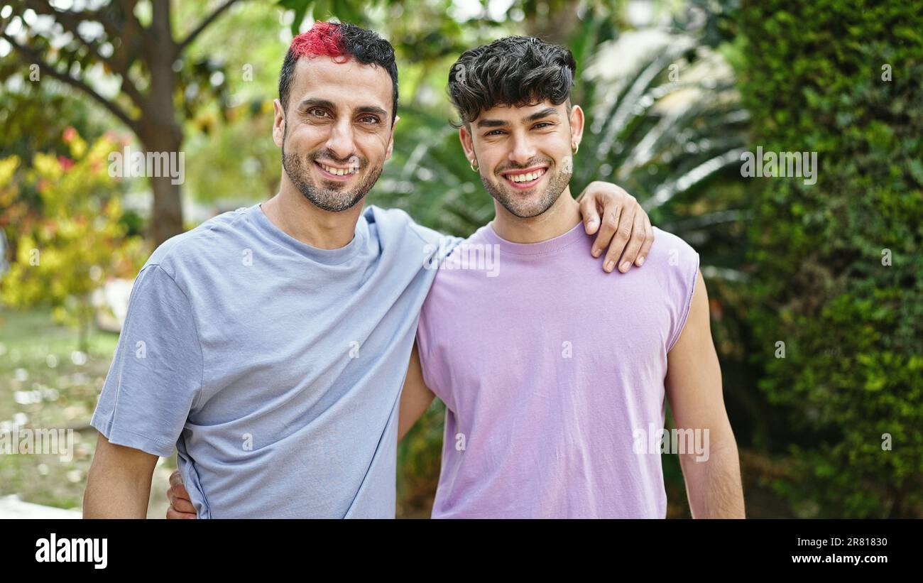 Two men couple smiling confident hugging each other at park Stock Photo ...
