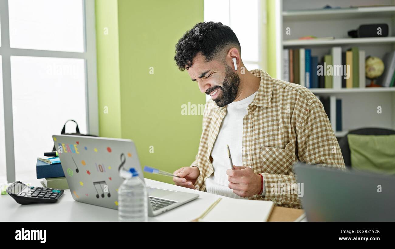 Student playing with pen classroom hi-res stock photography and images ...