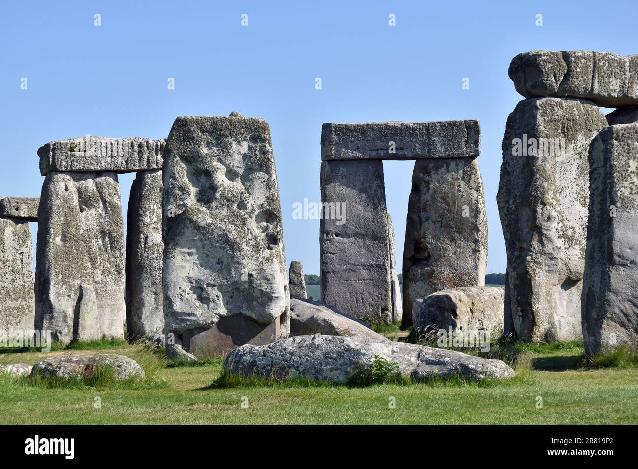 Heel stone seen through Sarsen stones Stock Photo - Alamy