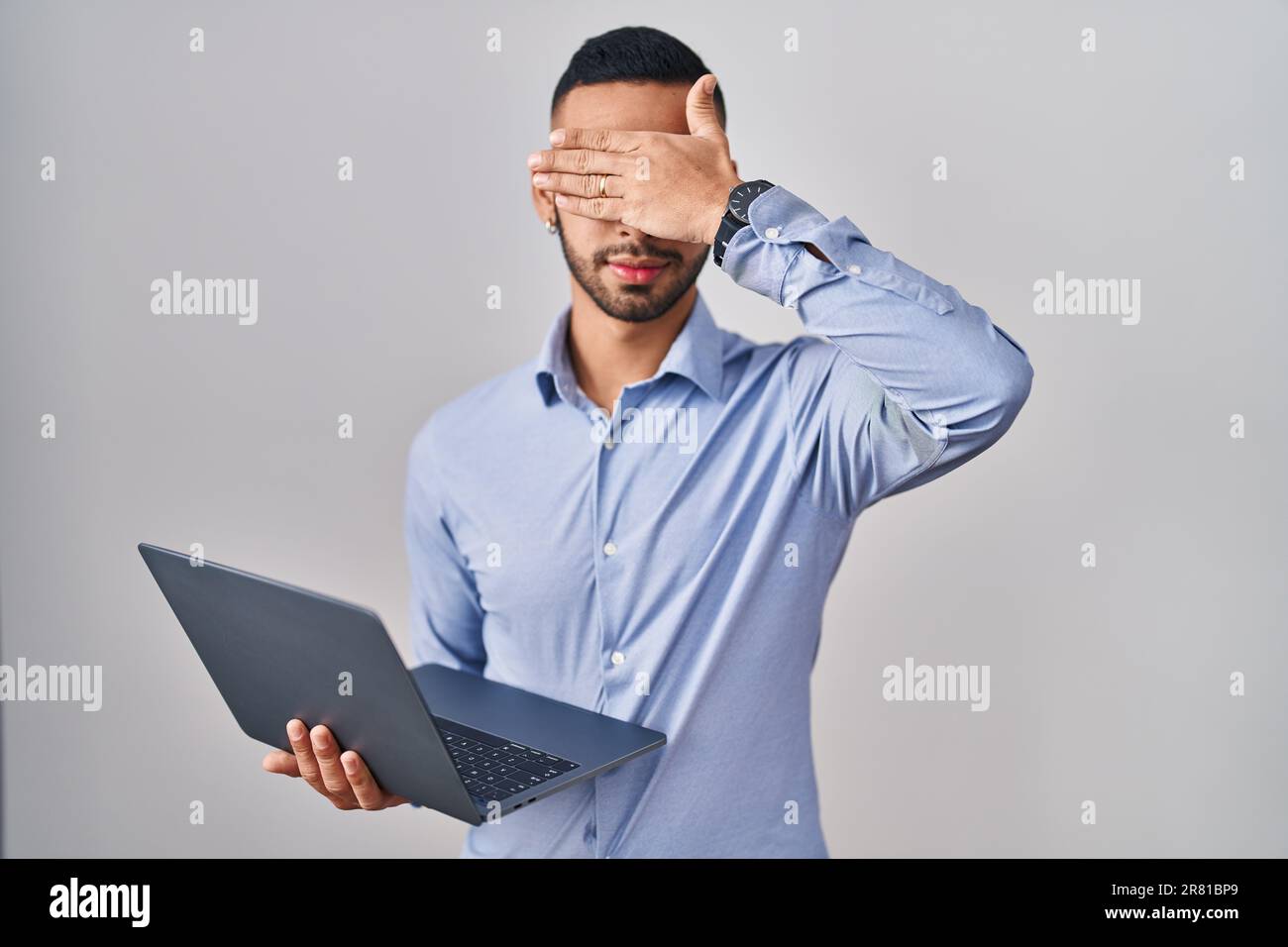 Young hispanic man working using computer laptop smiling and laughing ...