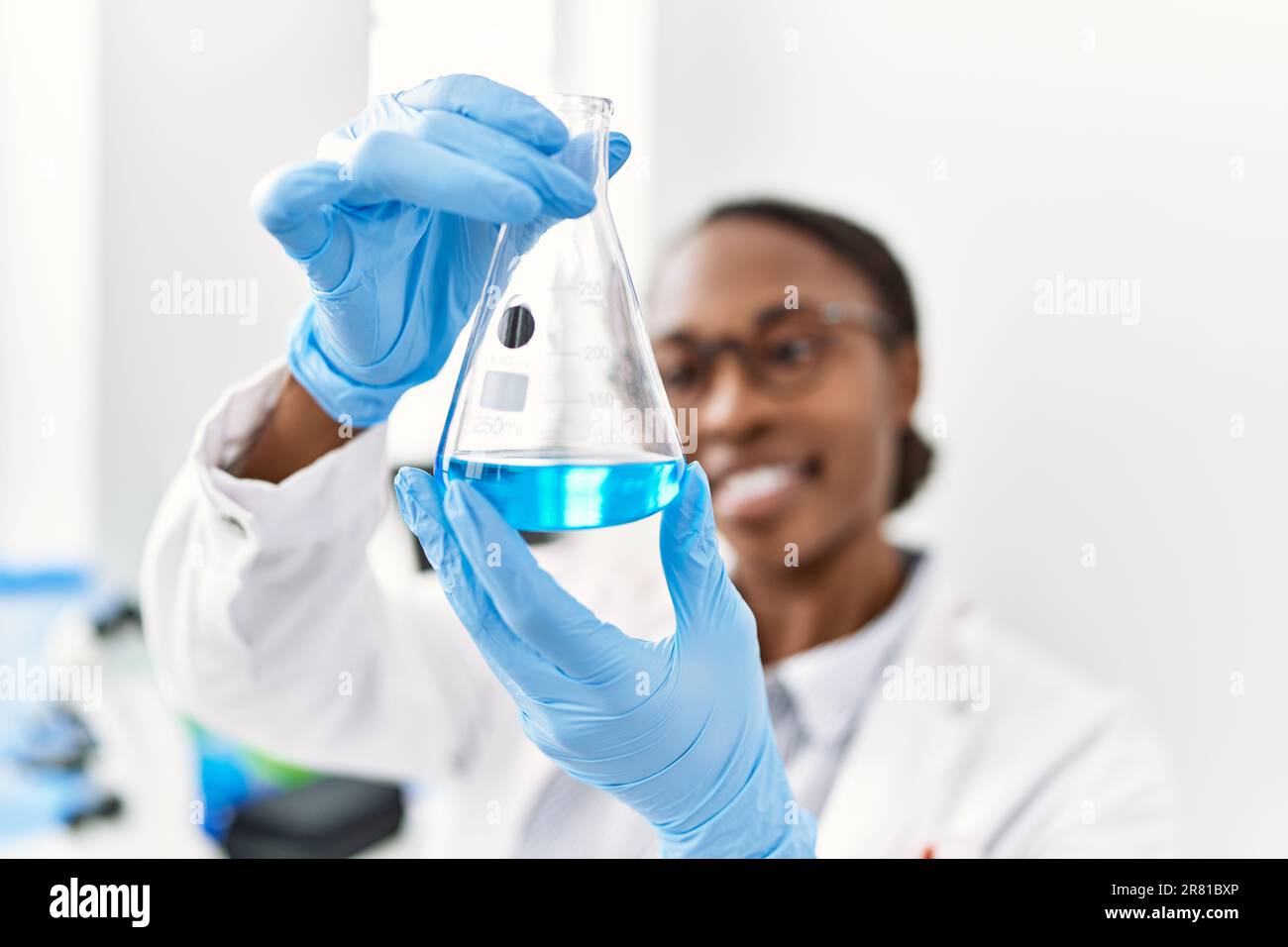 African american woman scientist holding test tube at laboratory Stock ...