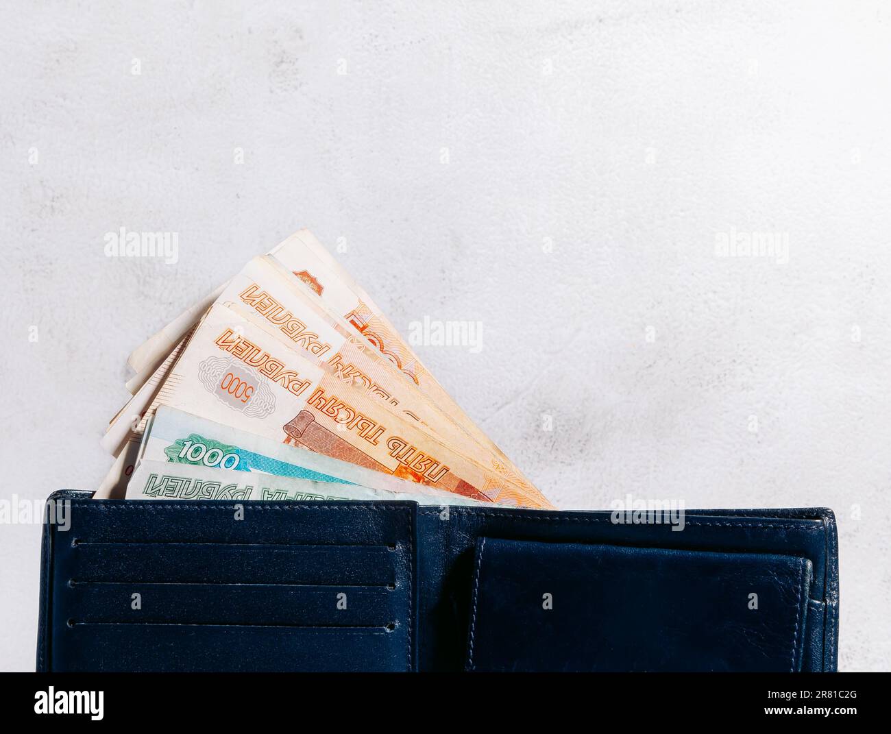 a close-up of a wallet containing bank cards and cash Russian money ...