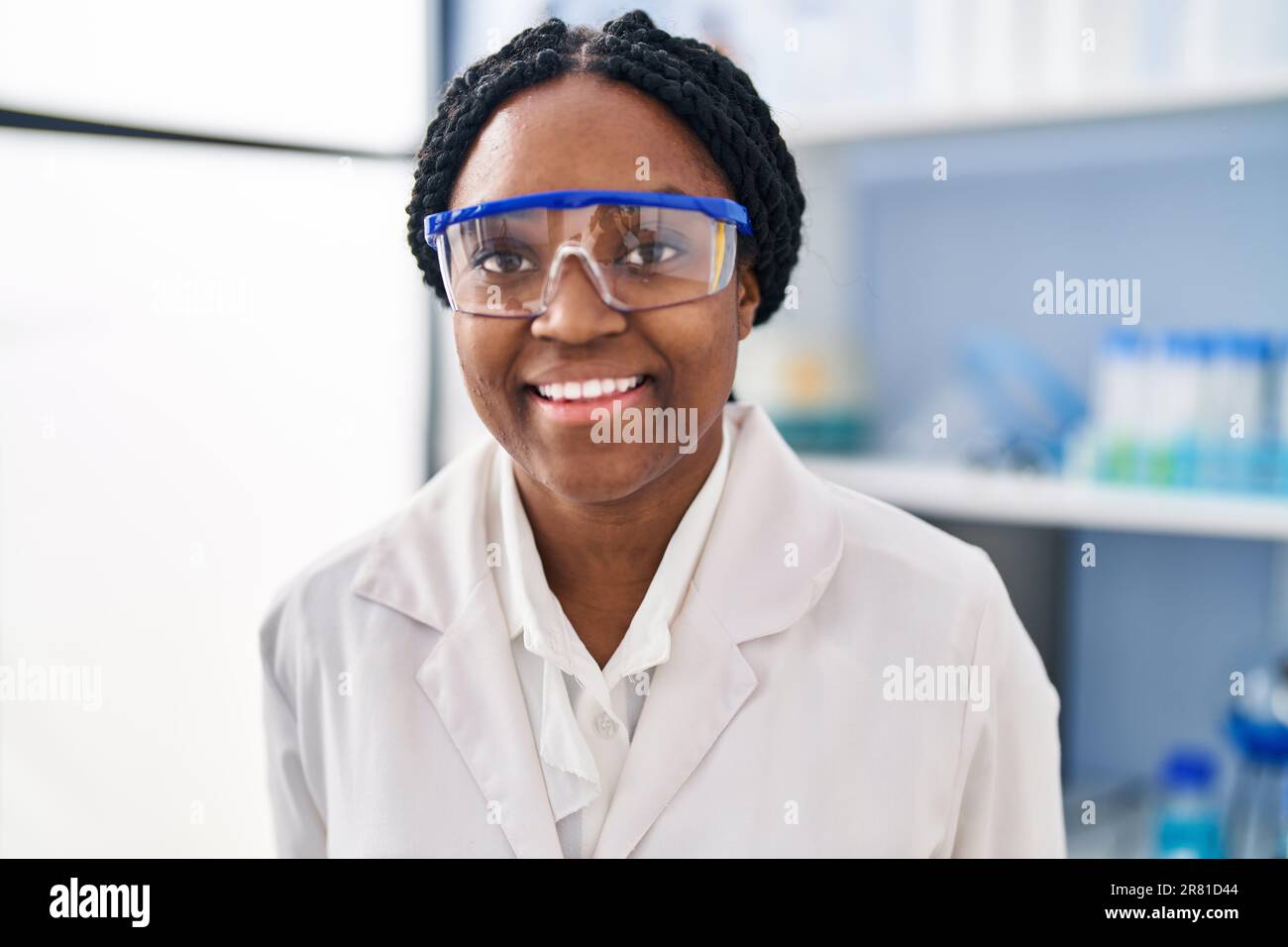 African american woman scientist smiling confident standing at laboratory Stock Photo - Alamy
