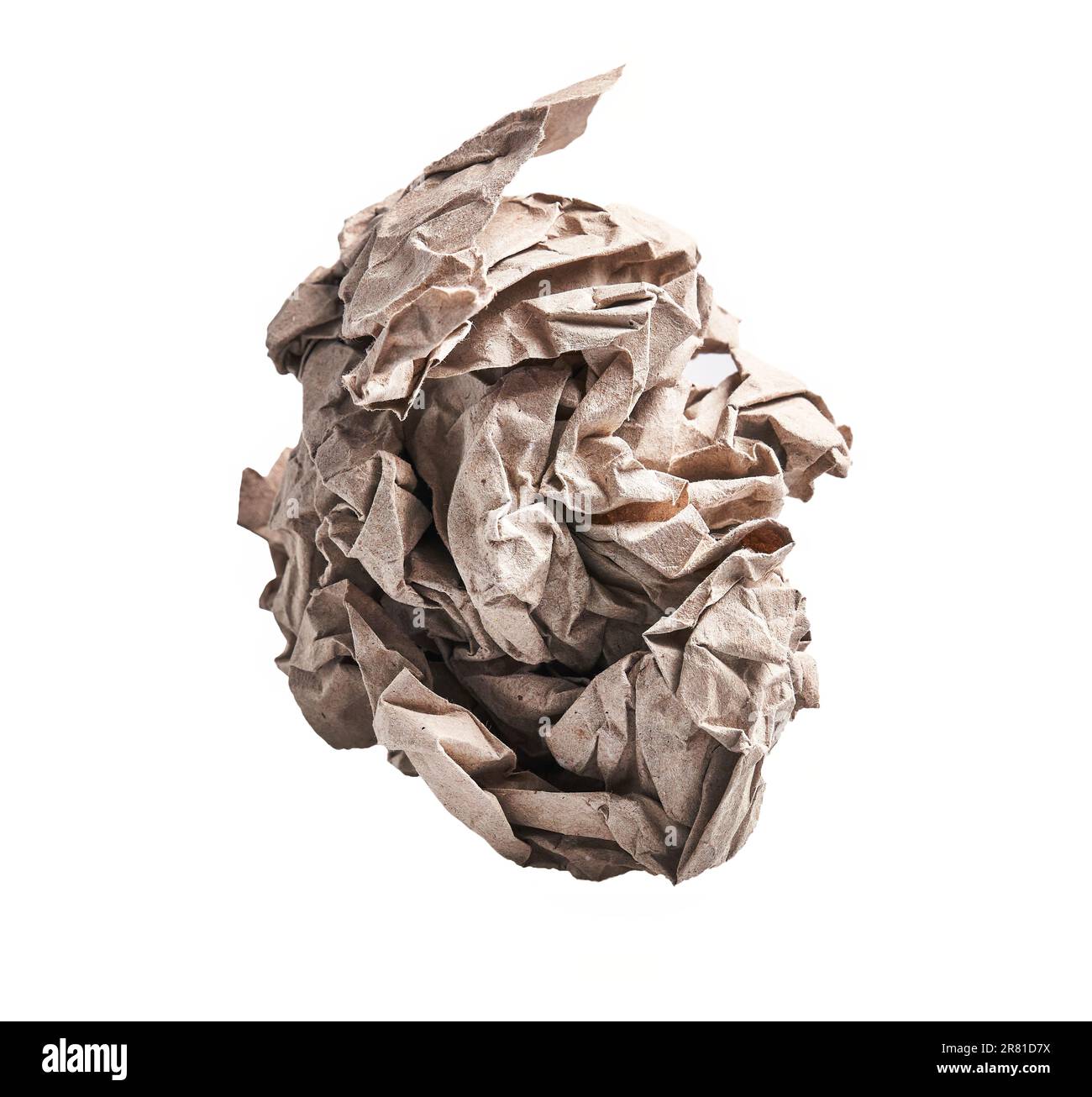 One brown crumpled paper ball over isolated white background Stock ...
