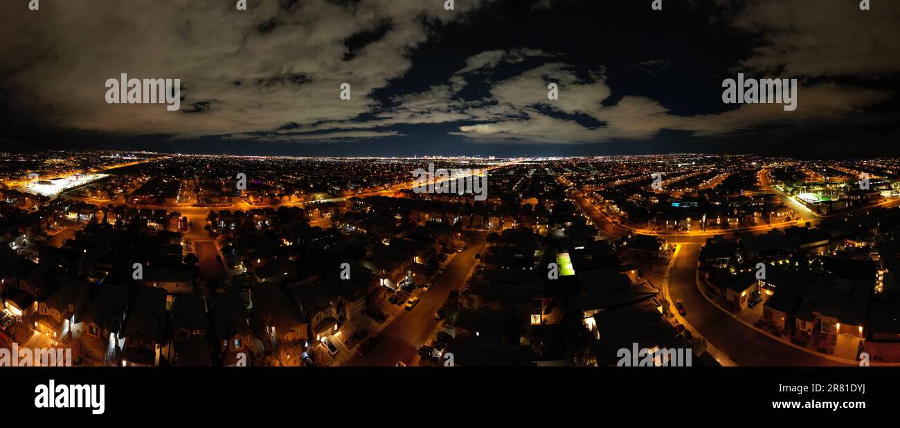 A spectacular aerial view of a bustling cityscape at night, with ...
