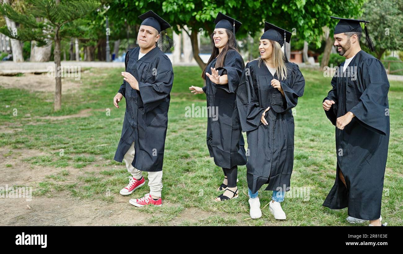 Group of people students graduated smiling confident dancing at ...