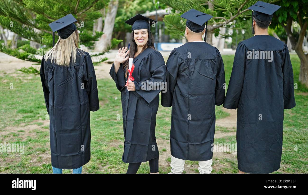Group of people students graduated holding diploma saying hello with ...