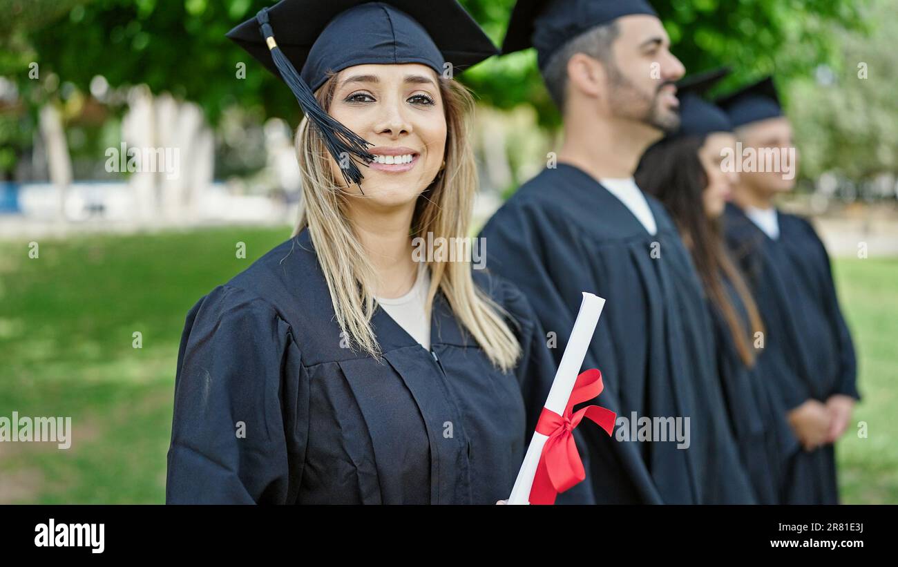 Group of people students graduated holding diploma at university campus ...