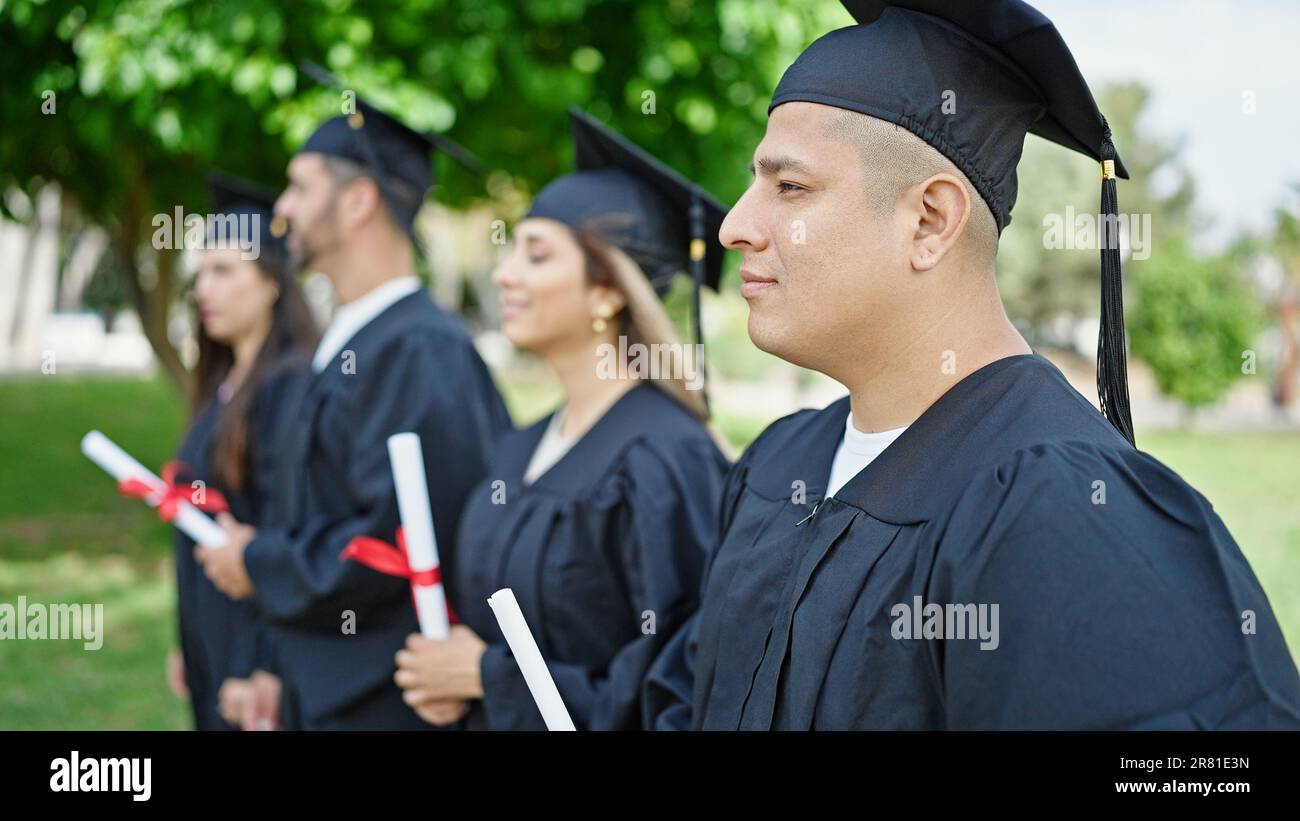 Group of people students graduated holding diploma at university campus ...